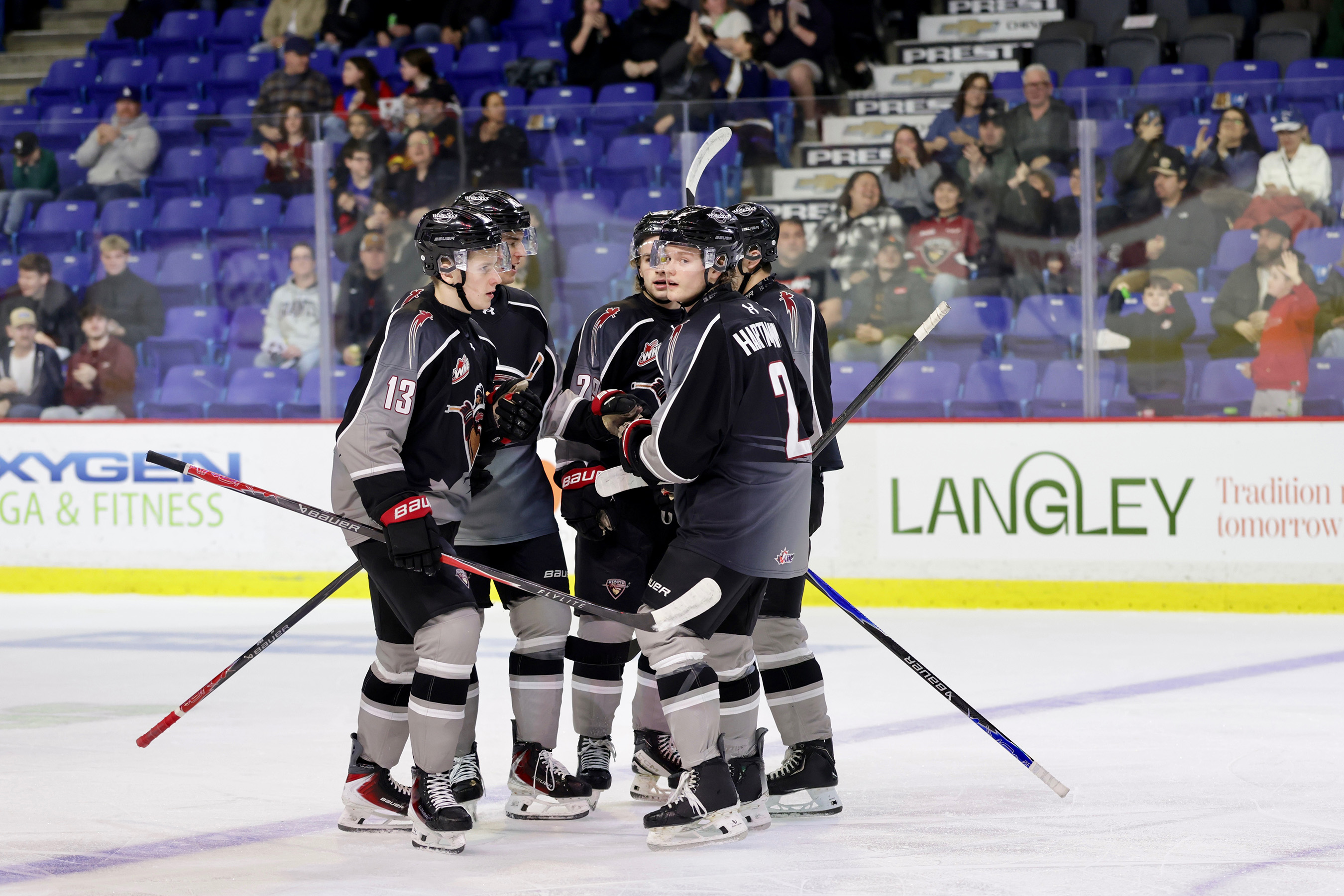 Vancouver Giants' Tobias Tomik and Kaleb Hartmann talk with teammates ...